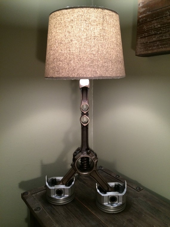 Hand crafted table lamp using repurposed engine/car parts.