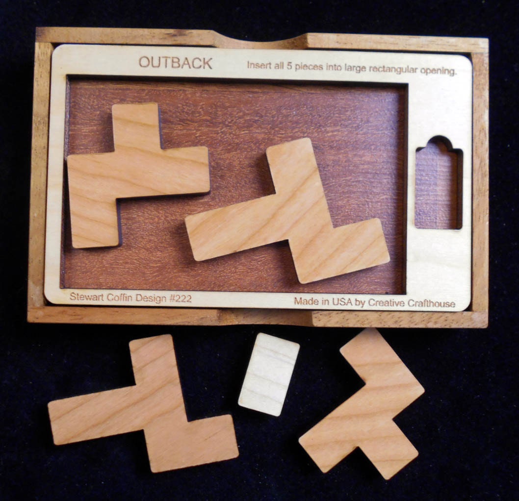 OUTBACK puzzle insert all pieces into the large opening.