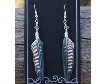 Popular items for leather feather earrings on Etsy