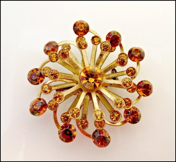 Atomic Brooch Amber Rhinestones In A Gold Tone Setting