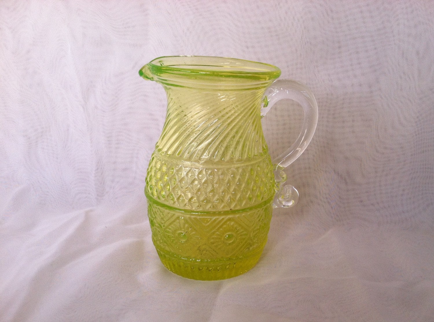 A vintage Imperial three mold blown vaseline glass creamer, with ...
