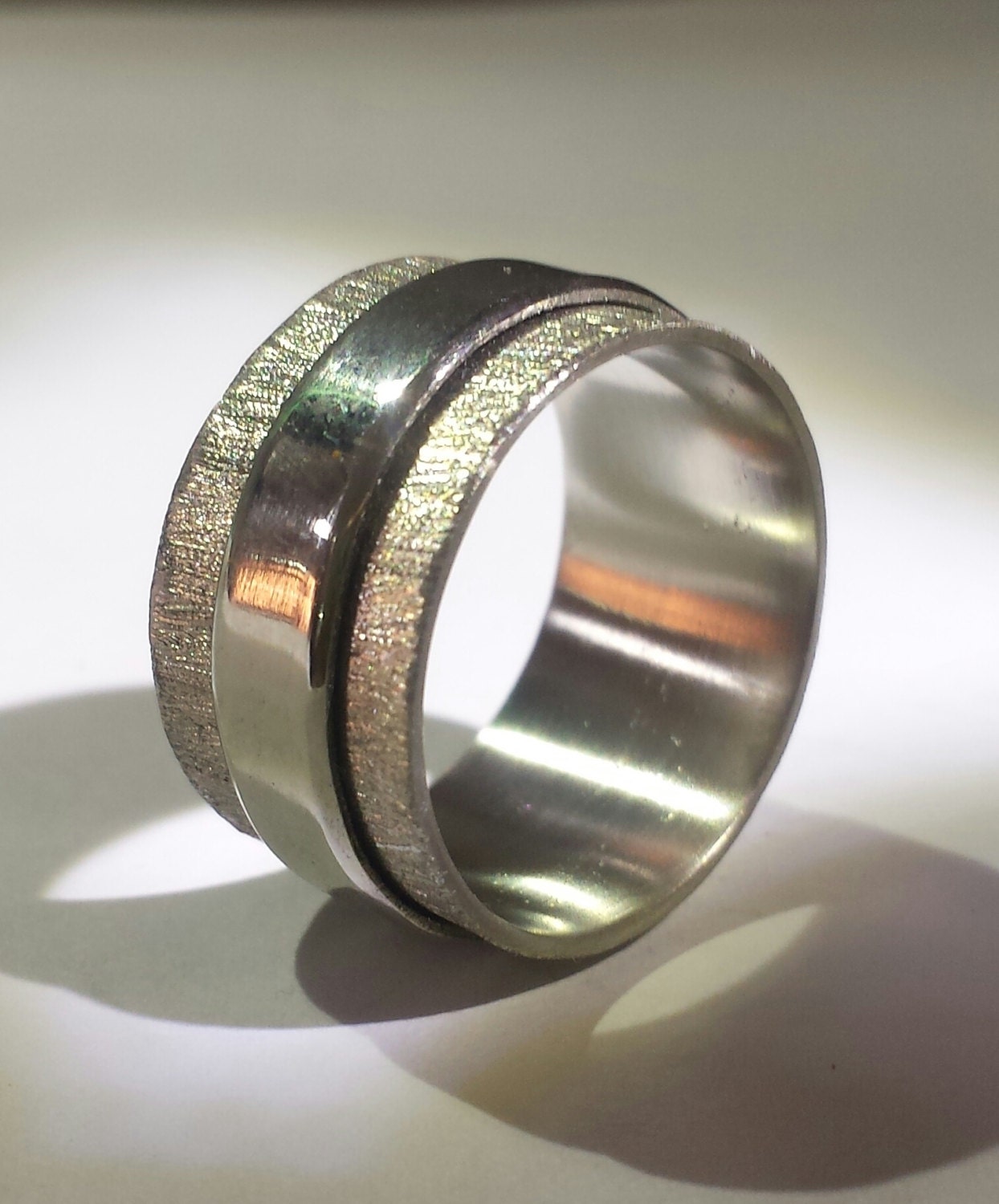 Silver ring with engraved personalized text.