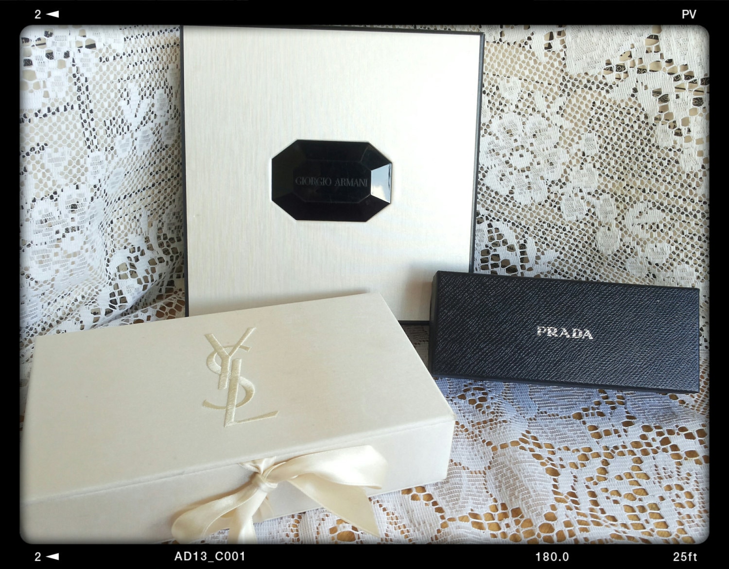 Vintage empty designer boxes, Armani, YSL, Prada, a set of three ...