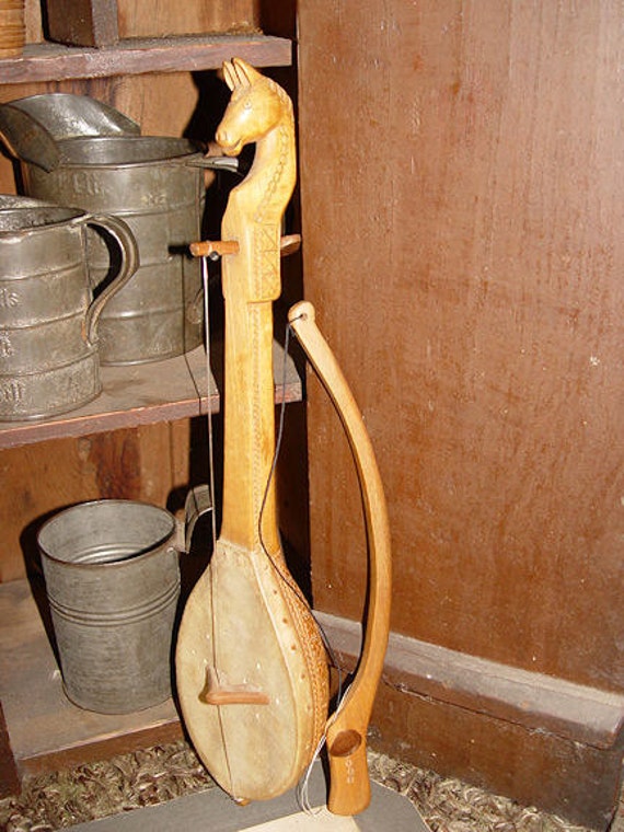 Vintage Carved Horse Head Musical Instrument by PetesRetroGarage