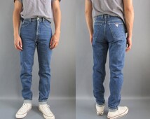 Popular items for 90s guess jeans on Etsy