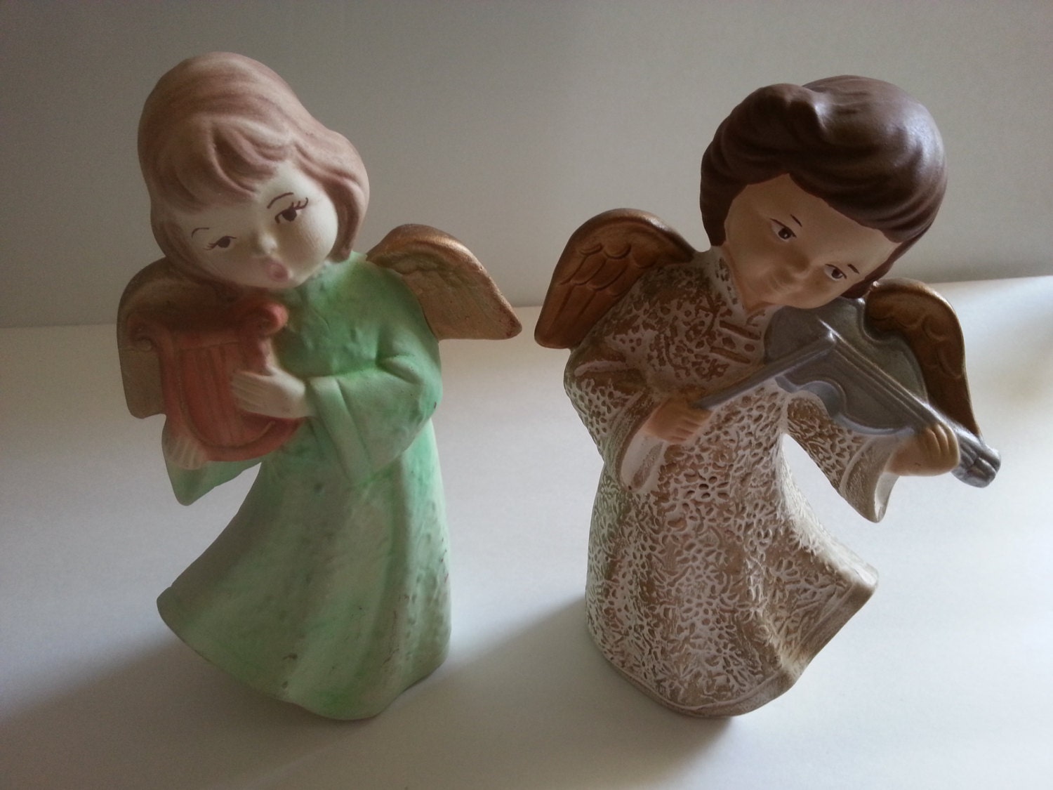 Two Ceramic Angels Playing Musical Instruments