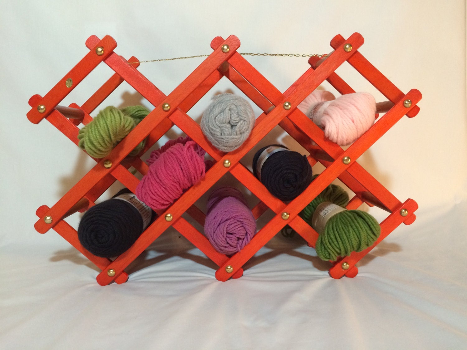 collapsible orange wood rack, wine storage, yarn storage – Haute Juice