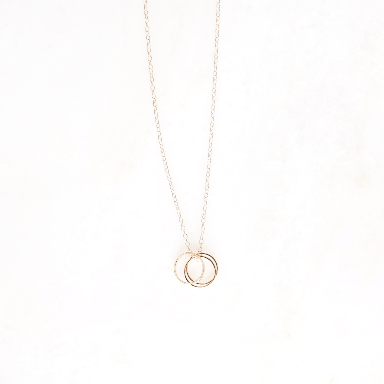 TRIO gold/silver three ring necklace. faith hope love.