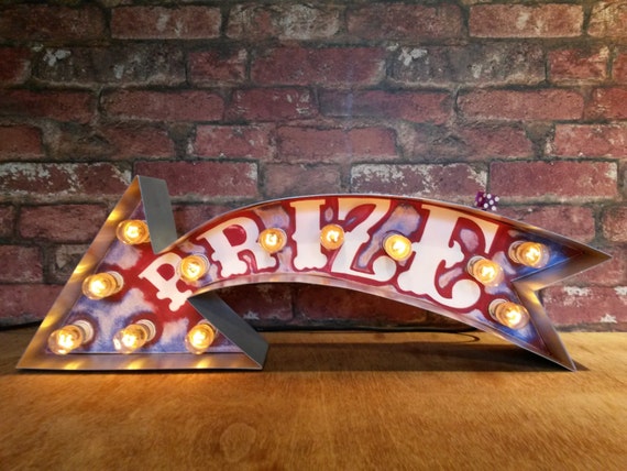 marquee circus letter 'PRIZE' arrow.