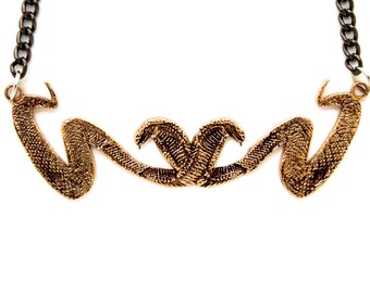 Intertwined snakes | Etsy