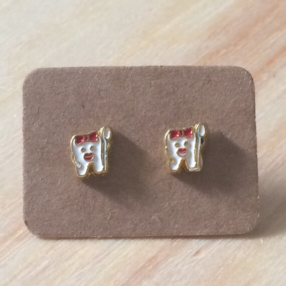 Items similar to Happy tooth studs on Etsy