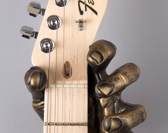 How Does Yours Hang Hand Shaped Guitar Hangers by GuitarGrips