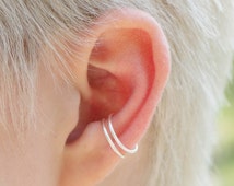 Unique faux conch earring related items | Etsy