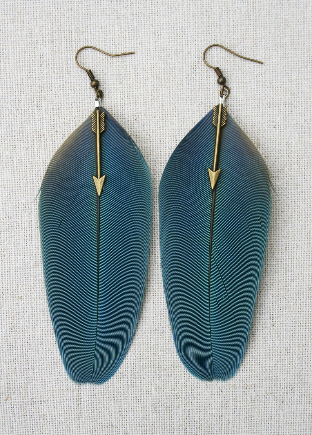 Large blue macaw parrot feather earrings with bronze arrow