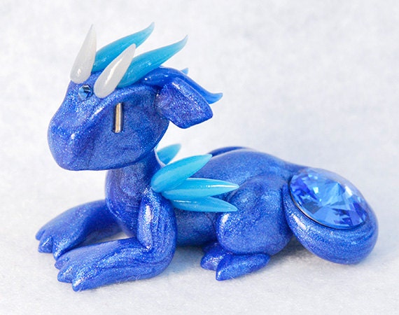 September birthstone dragon with sapphire gem blue dragon