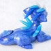 September birthstone dragon with sapphire gem blue dragon