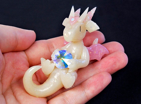 October birthstone dragon with opal gem white and pink