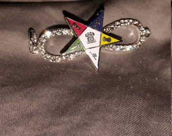 Items similar to OES clip earrings & pendant on Etsy