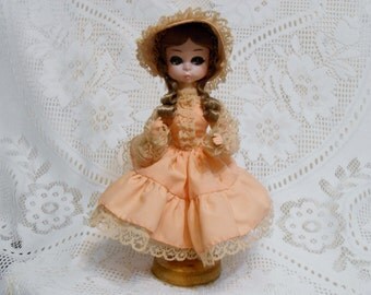 Berkeley Designs Stuffed music box doll in a rocking chair