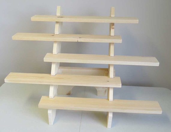 Collapsible riser portable display stand store by PortableDisplays