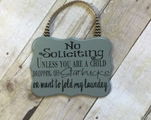 No soliciting sign, starbucks sign, laundry sign, wooden sign, house ...