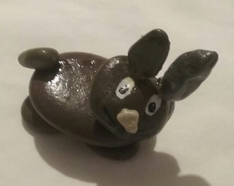 Items similar to Painted skunk rock on Etsy