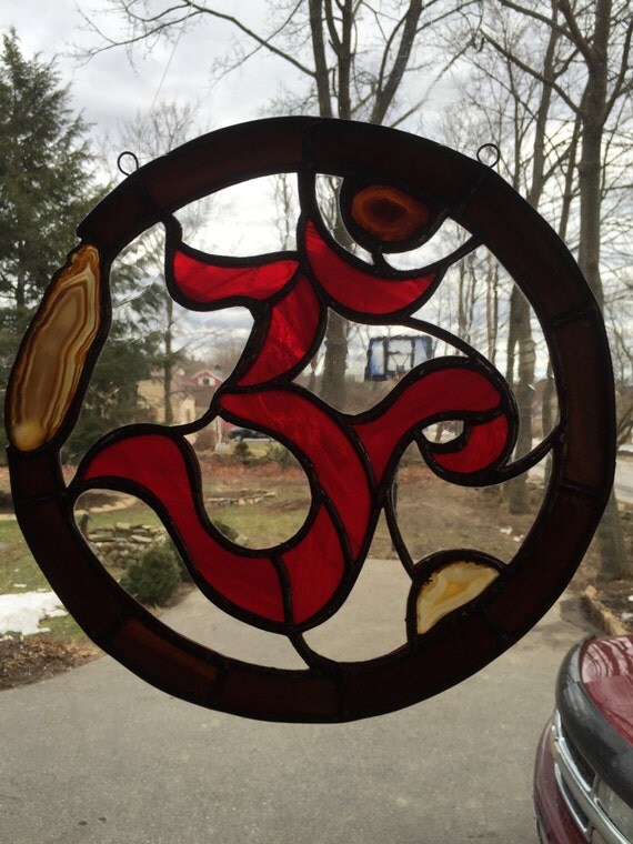 Stained glass OM symbol Om symbol with agate stones Sun