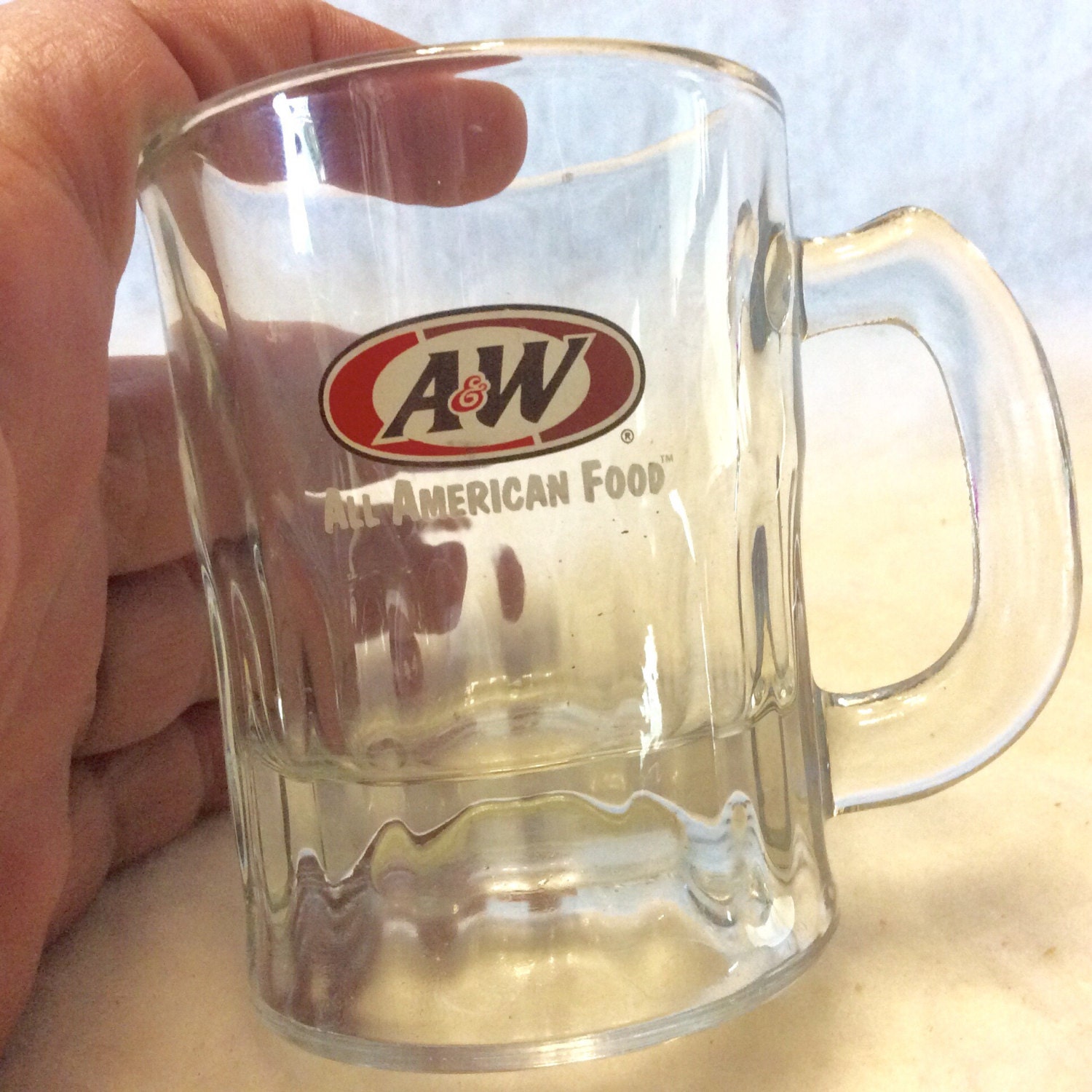 A and W baby root beer mug. Oval label All American Food.