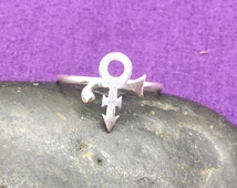 Popular items for prince symbol on Etsy