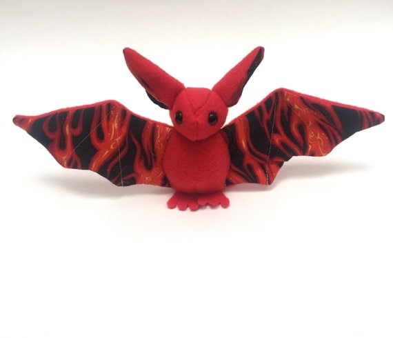 Small red bat with flames and fire print soft stuffed plush