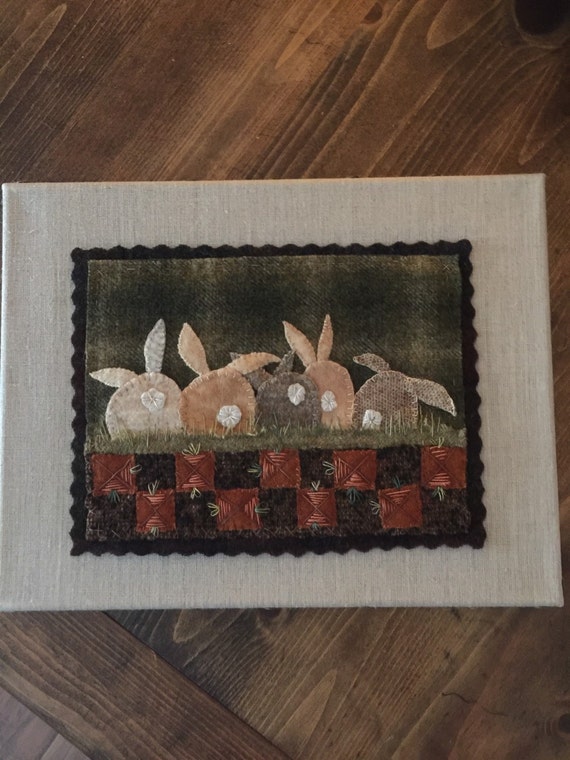 Wool applique pattern called Carrot Patch by SusanGonzalesDesigns