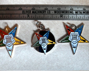 Items similar to OES clip earrings & pendant on Etsy