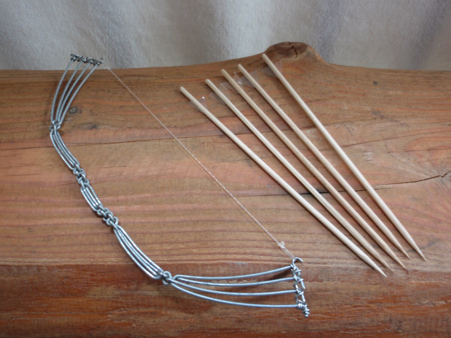 fully functional miniature recycled spring-steel bow and arrow