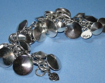 Items similar to Upcycled vintage buttons charm bracelet on Etsy