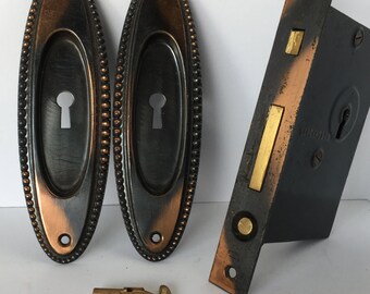 Rice Double Pocket Door Locking Set by CharlestonHardwareCo