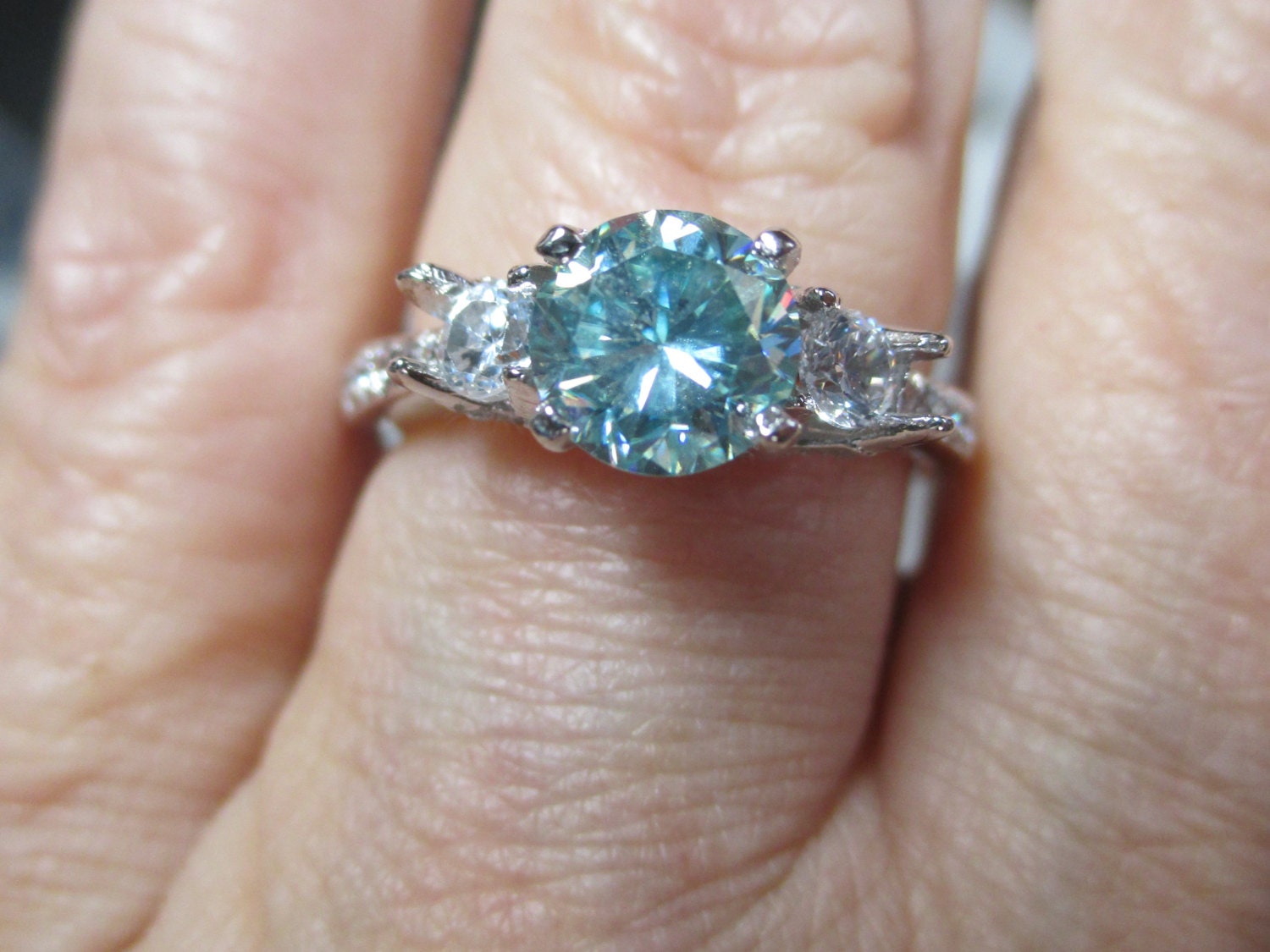 Ladies stunning blue moissanite ring with accents is a gorgeus