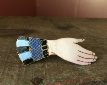 Items similar to 1900's / antique HAND brooch / old plastic / holding ...