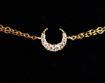 Diamond and white gold crescent moon necklace with diamond
