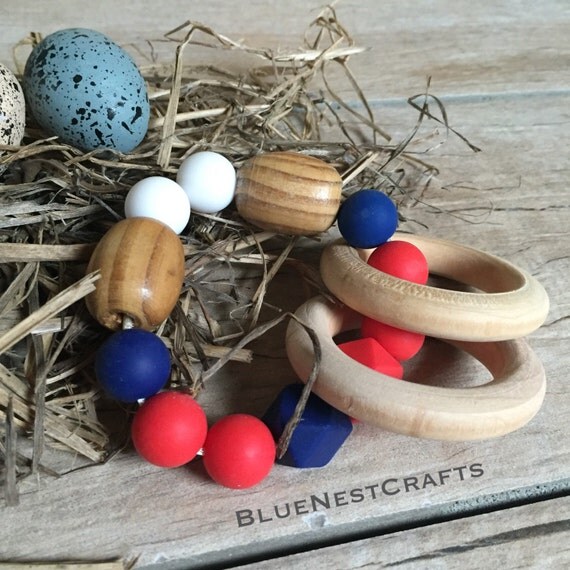 Items similar to Red/white/navy silicone chew bead rattle with natural ...