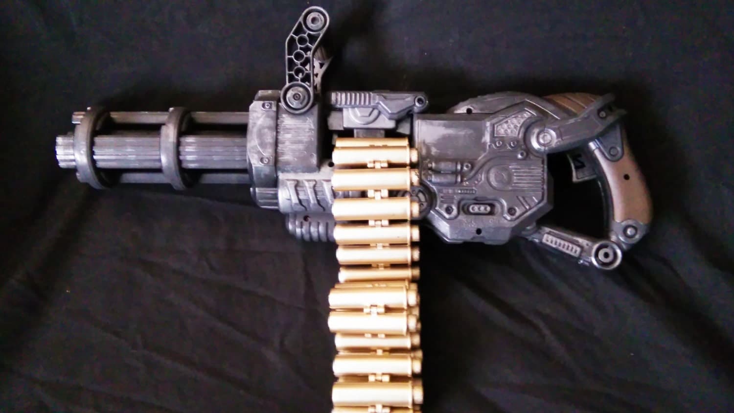 Hand painted chain gun with rotating barrel.