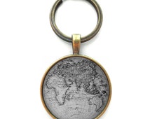 Popular items for world map keychain on Etsy
