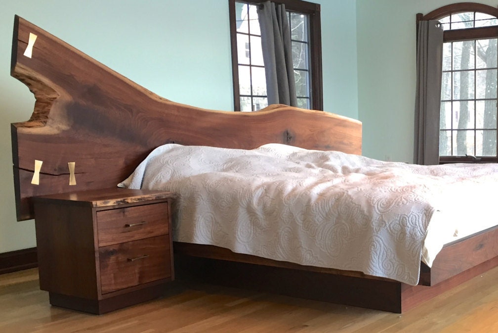 Natural edge walnut bed set with solid bronze accents.