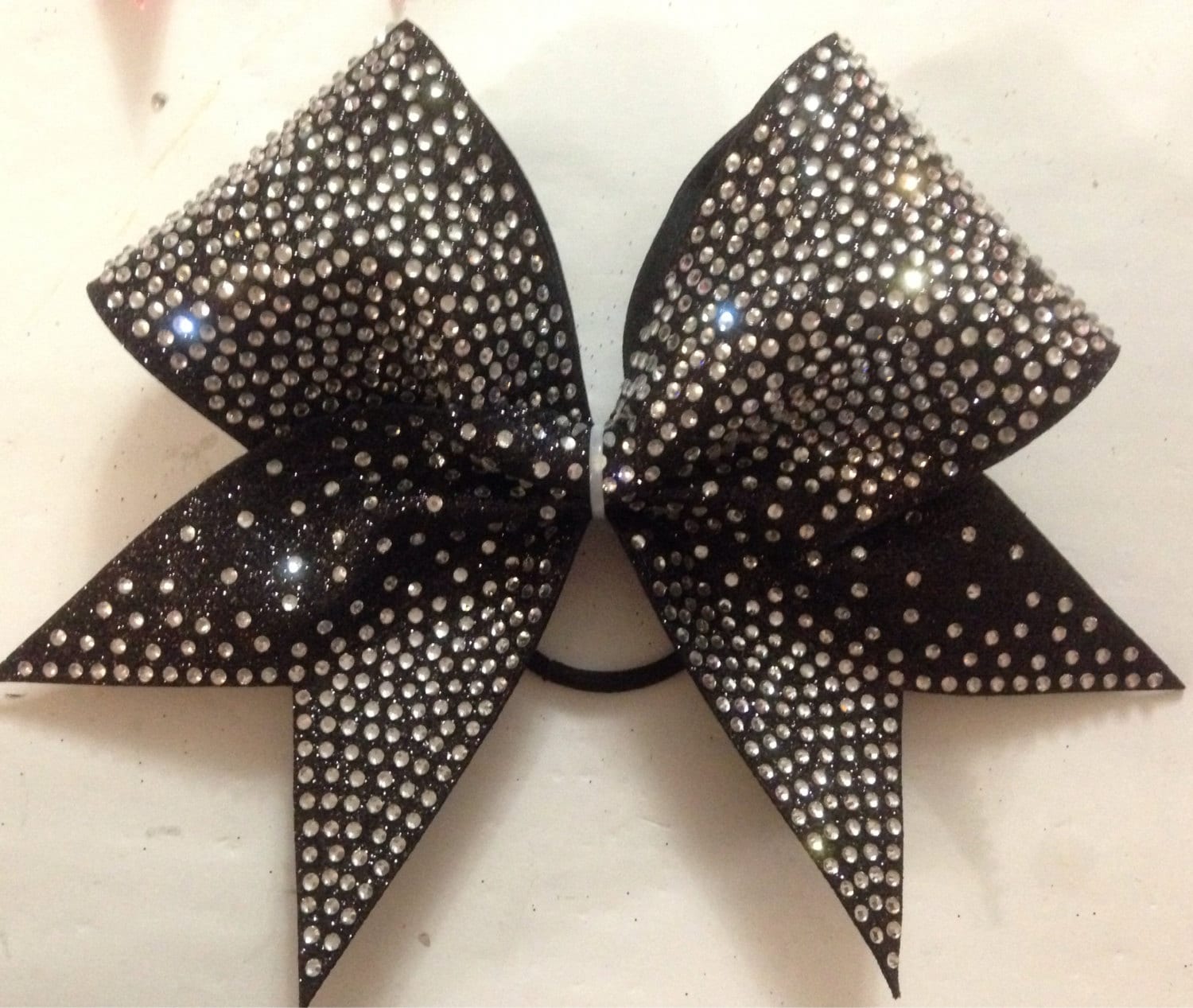 Rhinestone Royalty-Texas cheer bow In Black Super Glitter.