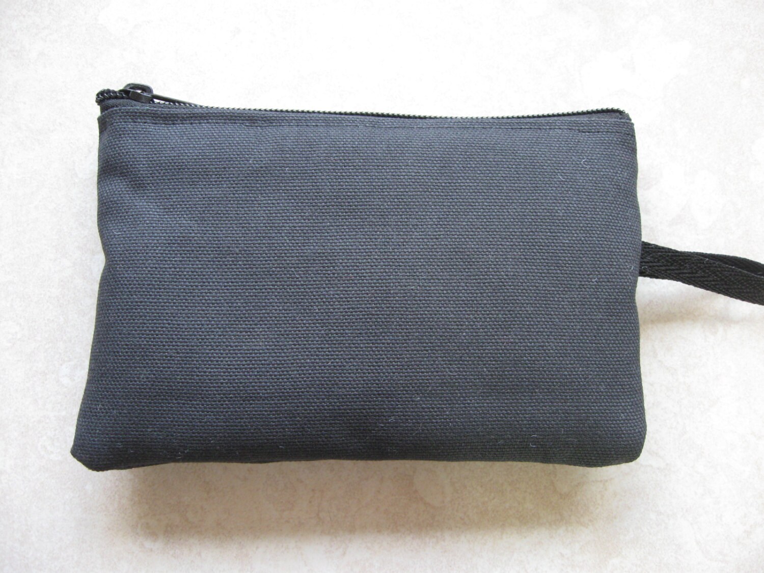 padded zipper pouch in black duck canvas