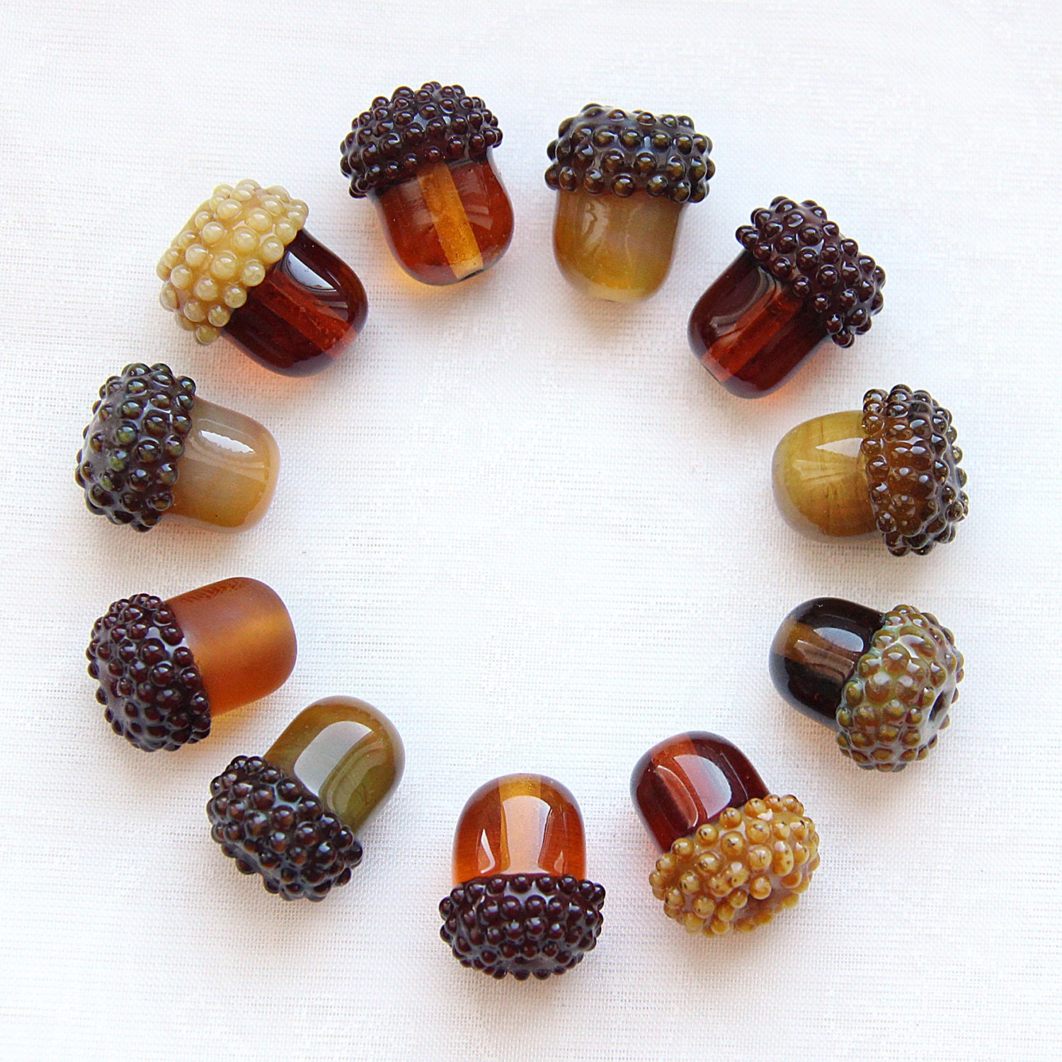 Glass lampwork acorn beads. Different colors.
