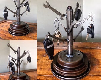 Hand crafted table lamp using repurposed engine/car parts.