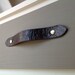 leather pull tab