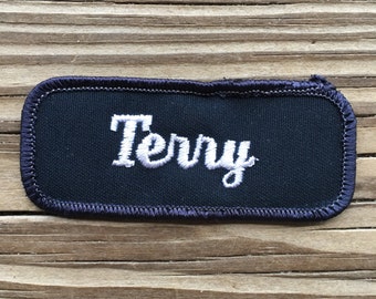 Zack. A yellow work shirt patch that says Zack in