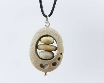 Hand carved rock necklaces by RockYouWear on Etsy