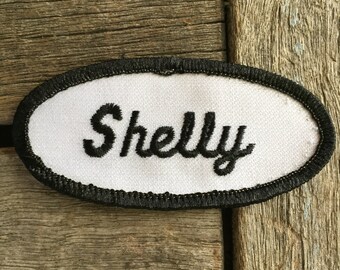 Zack. A yellow work shirt patch that says Zack in